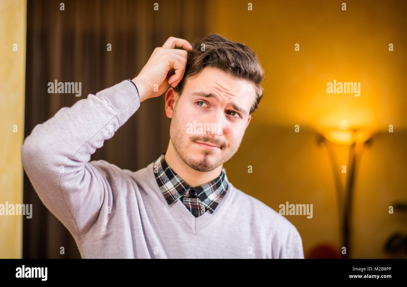 Person scratching head hi-res stock photography and images - Alamy