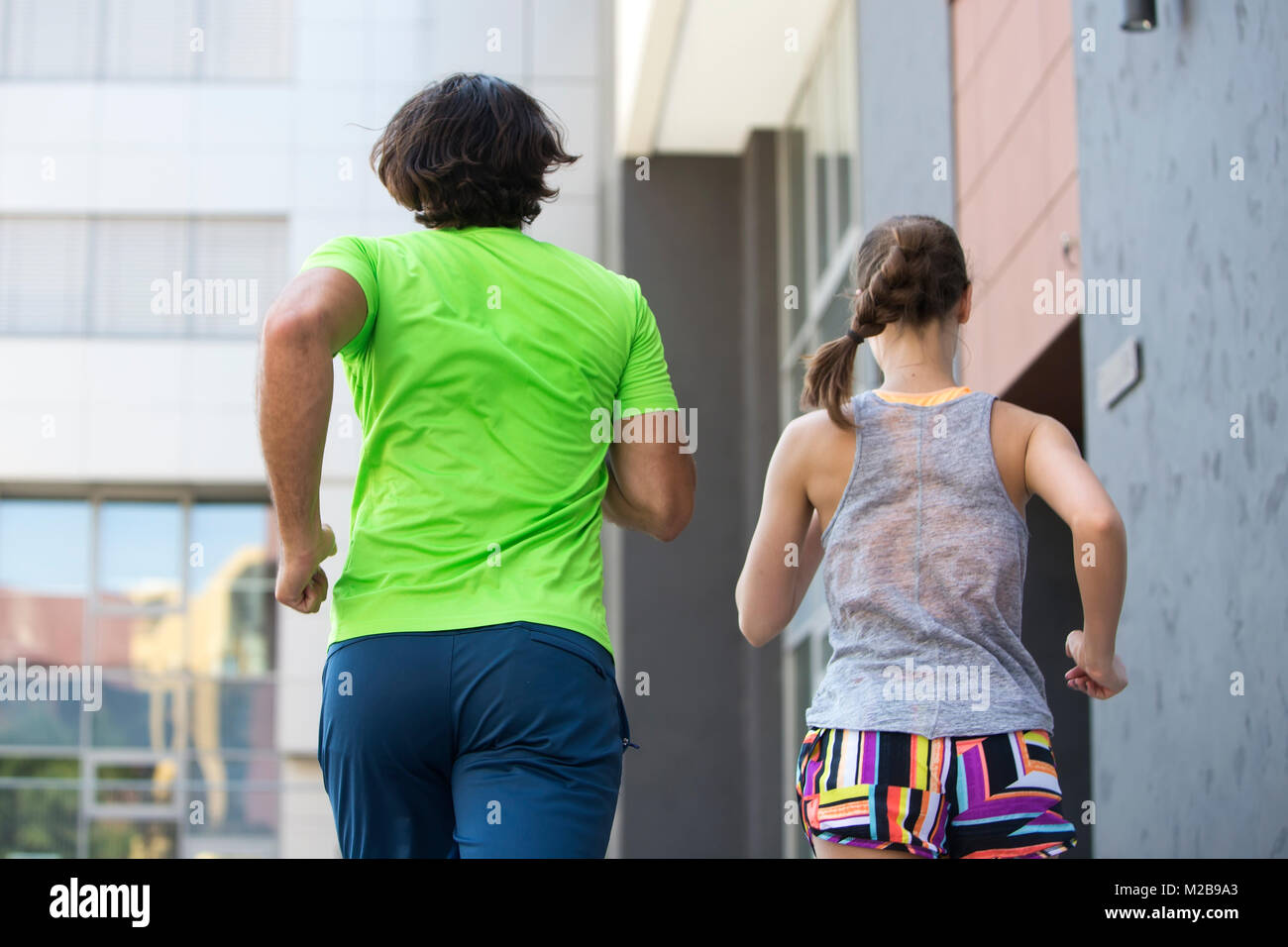 Back view at couple running outdoor Stock Photo - Alamy