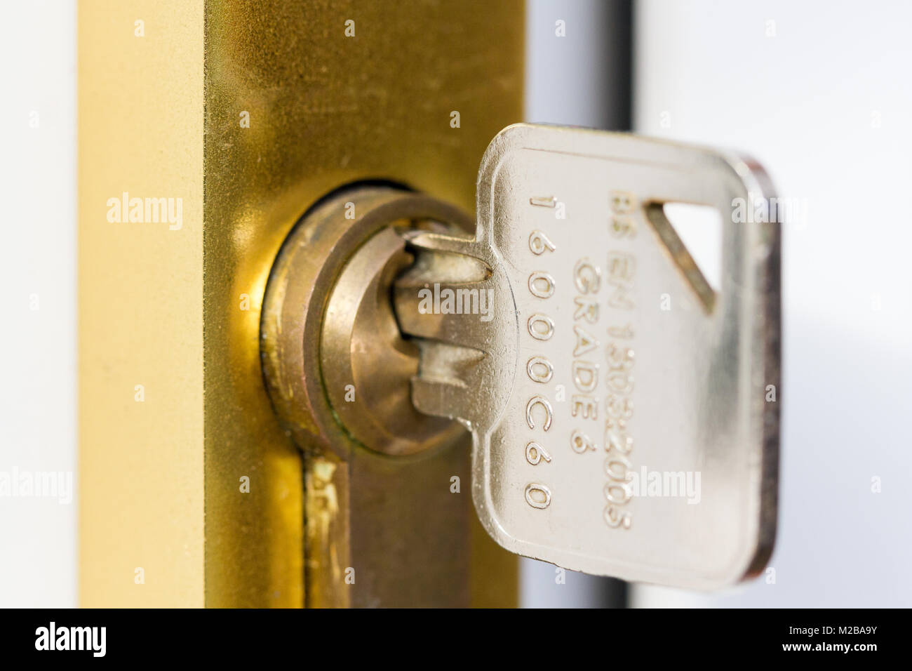 Close up of a key in a lock Stock Photo - Alamy