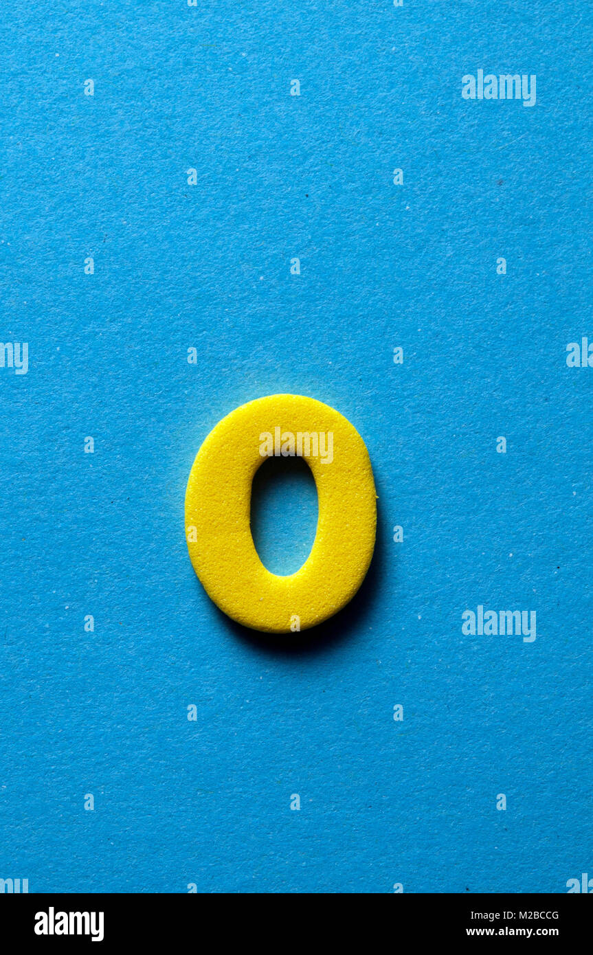 yellow number zero on blue background Stock Photo - Alamy