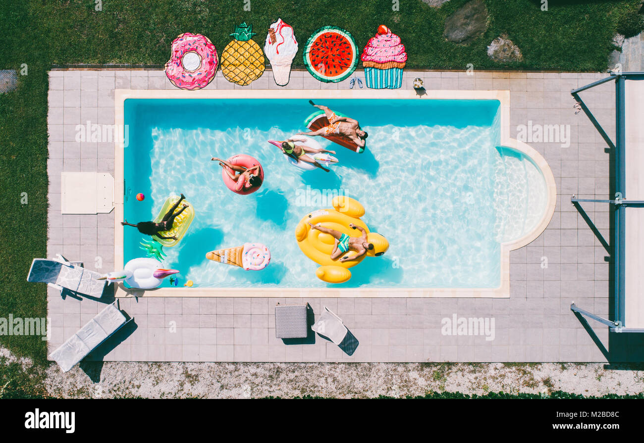 group of friends having fun in the swimming pool Stock Photo - Alamy