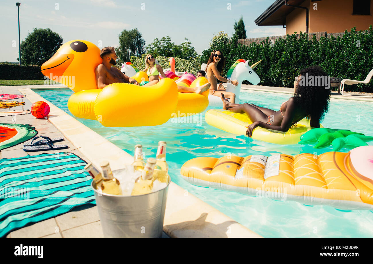 group of friends having fun in the swimming pool Stock Photo - Alamy