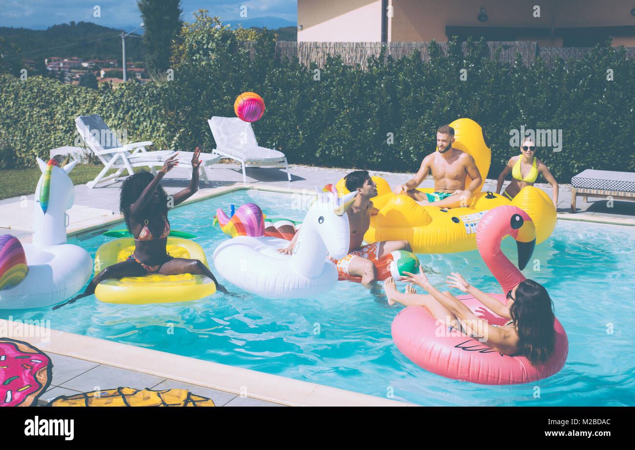 group of friends having fun in the swimming pool Stock Photo - Alamy