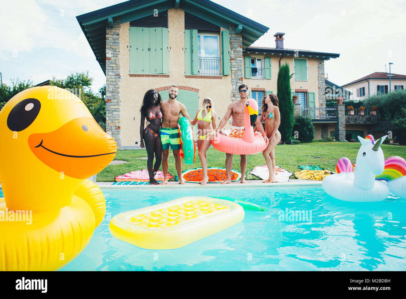 group of friends having fun in the swimming pool Stock Photo - Alamy