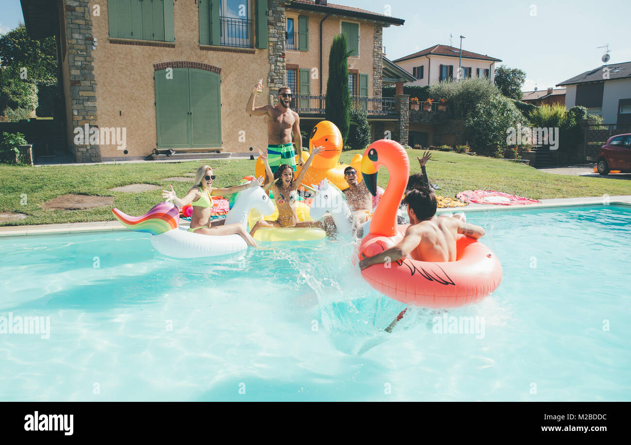 group of friends having fun in the swimming pool Stock Photo - Alamy