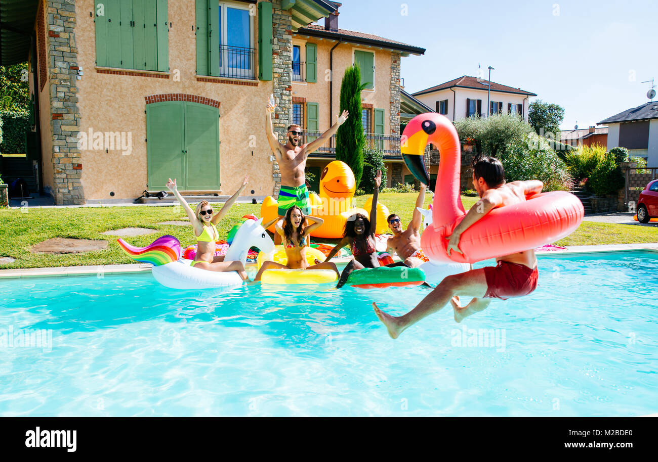 group of friends having fun in the swimming pool Stock Photo - Alamy