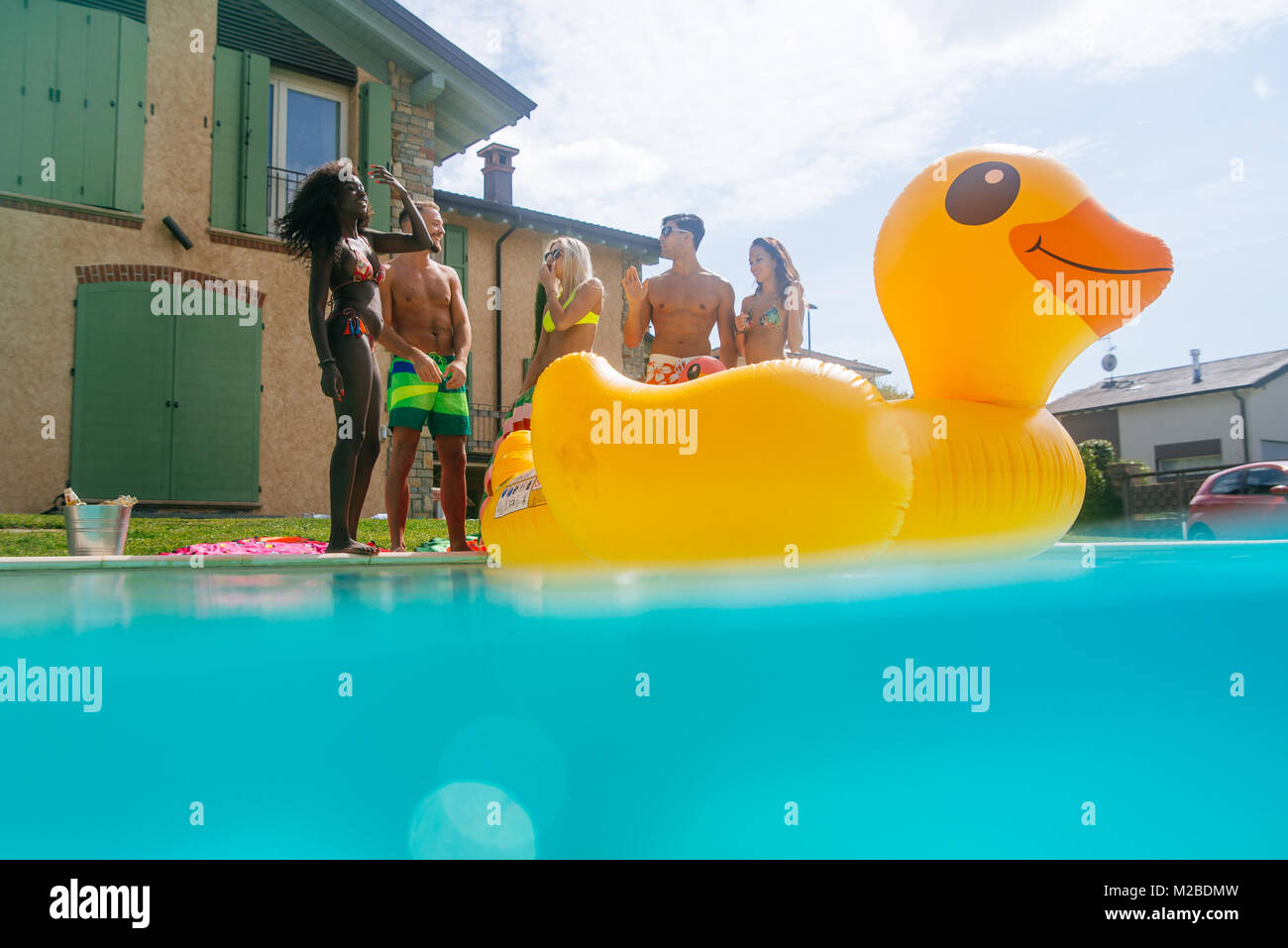 group of friends having fun in the swimming pool Stock Photo - Alamy