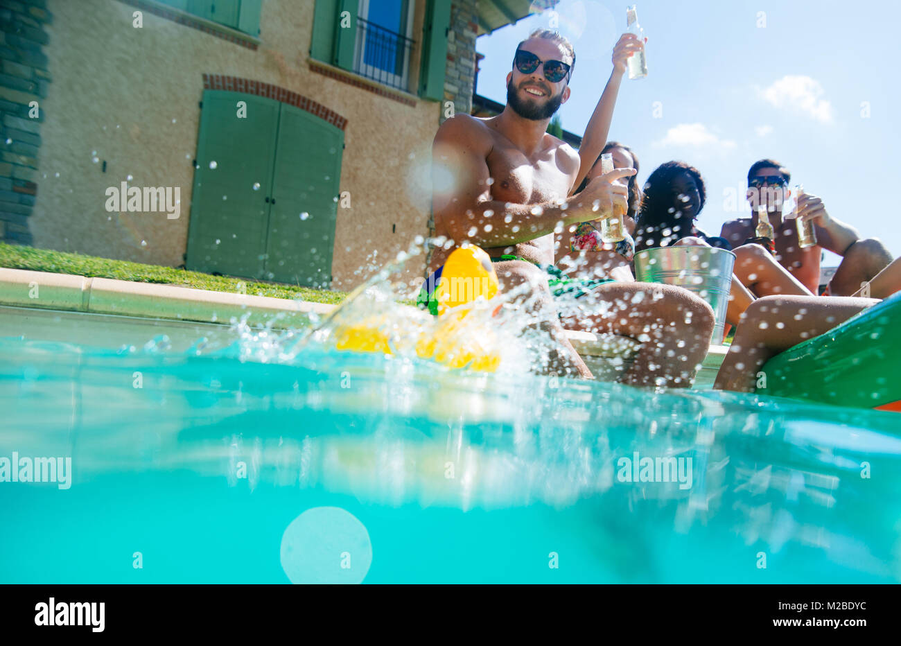 group of friends having fun in the swimming pool Stock Photo - Alamy