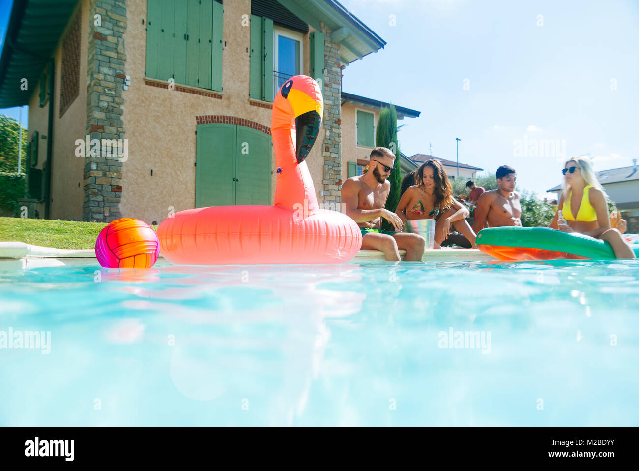 group of friends having fun in the swimming pool Stock Photo - Alamy