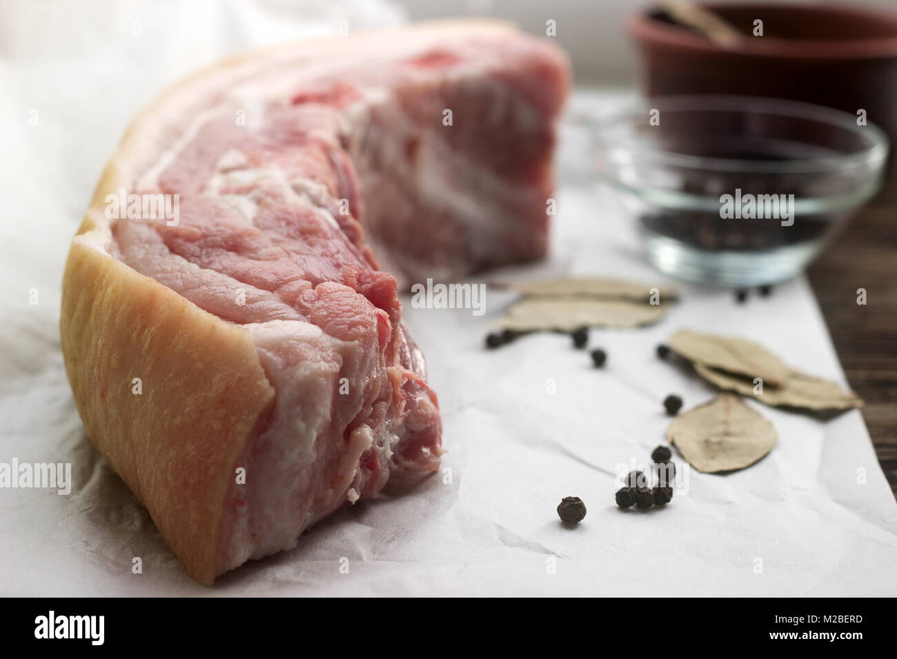 Raw fat pork belly on white paper Stock Photo - Alamy