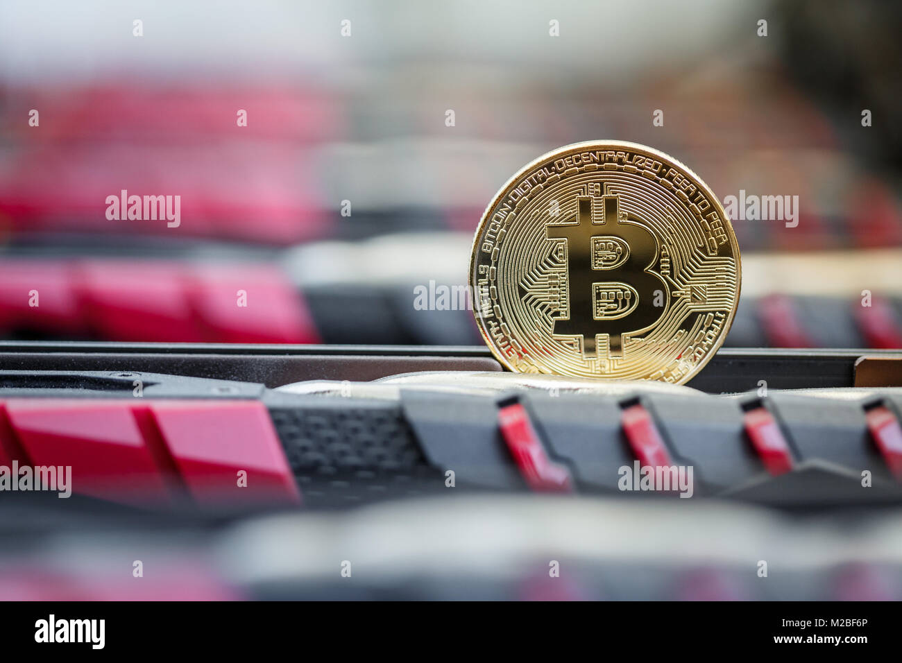 Golden metal coin as symbolic version of Bitcoin cryptocurrency on a ...