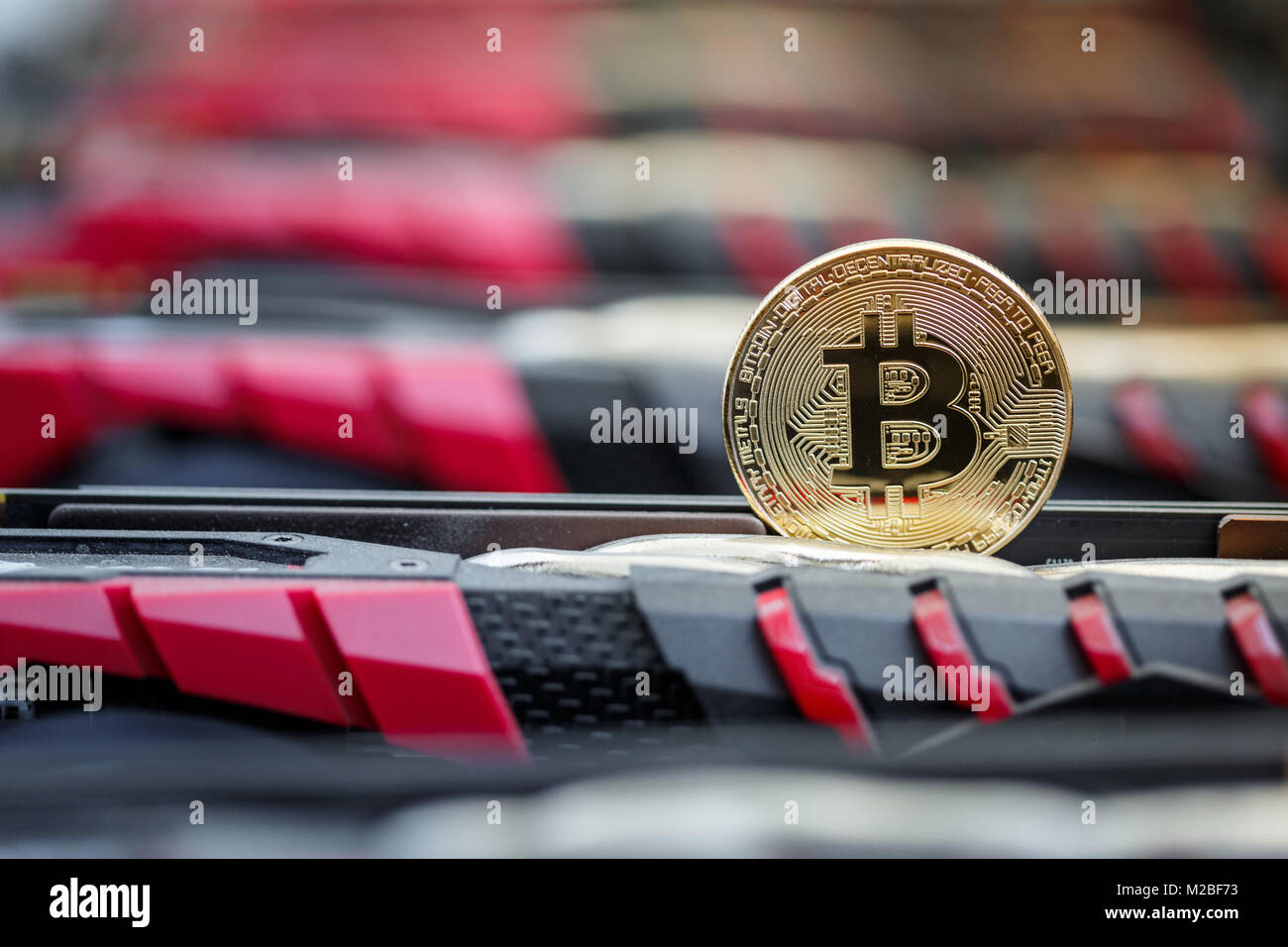 Golden metal coin as symbolic version of Bitcoin cryptocurrency on a ...