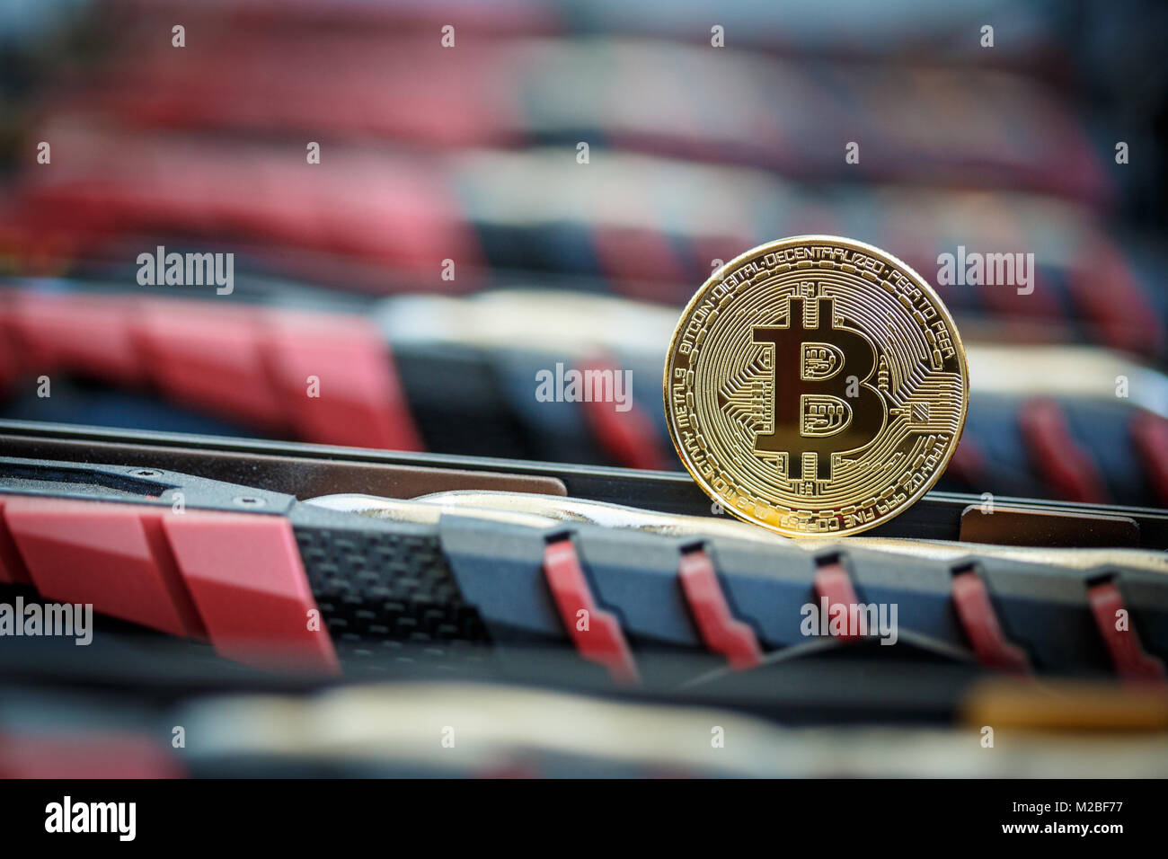 Golden metal coin as symbolic version of Bitcoin cryptocurrency on a ...