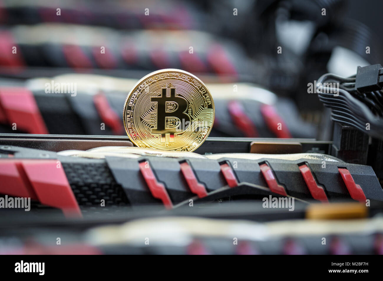 Golden metal coin as symbolic version of Bitcoin cryptocurrency on a ...