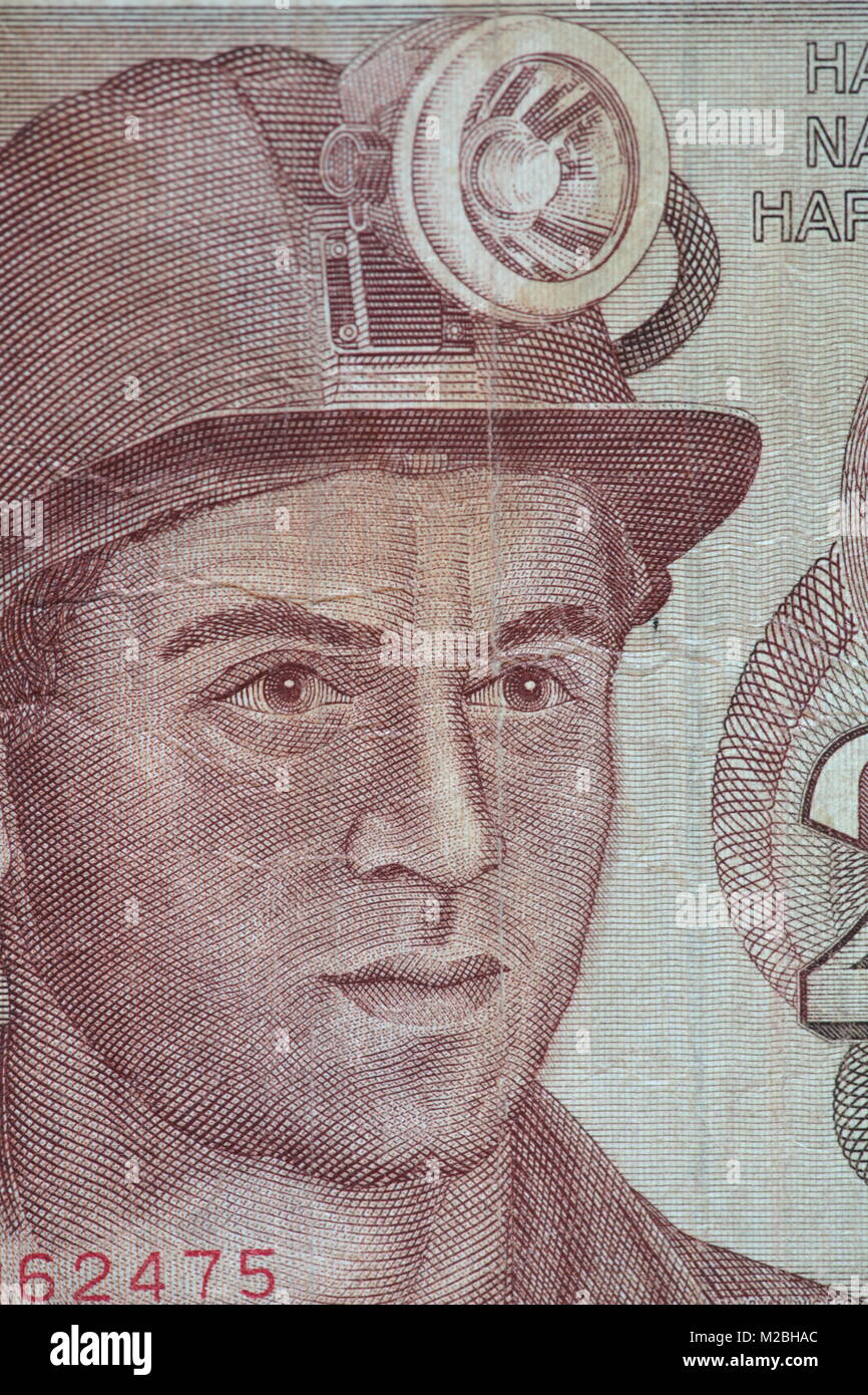 worker in a helmet with a lantern portrait on a banknote Stock Photo ...