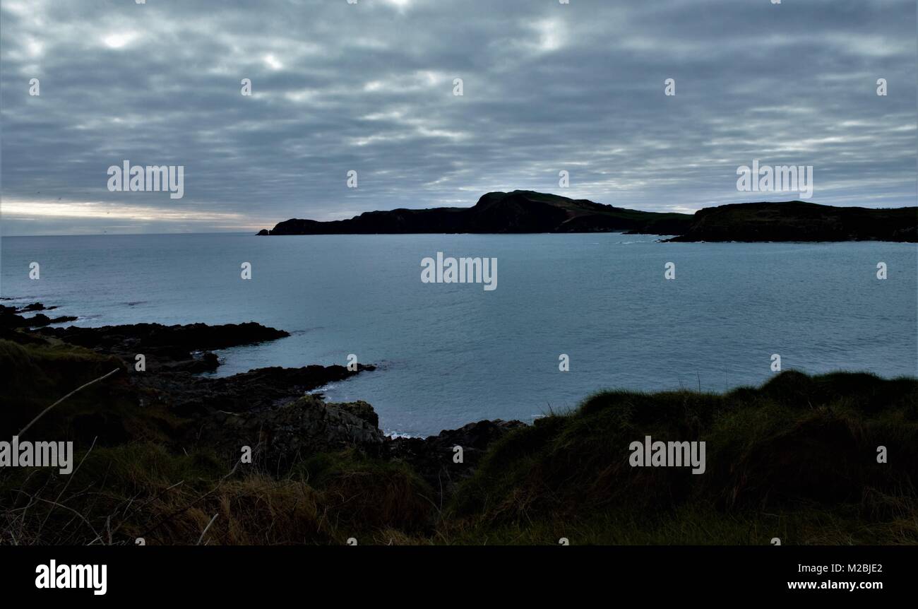 rocky coastline line of west cork, Ireland taken under a cloudy winter ...