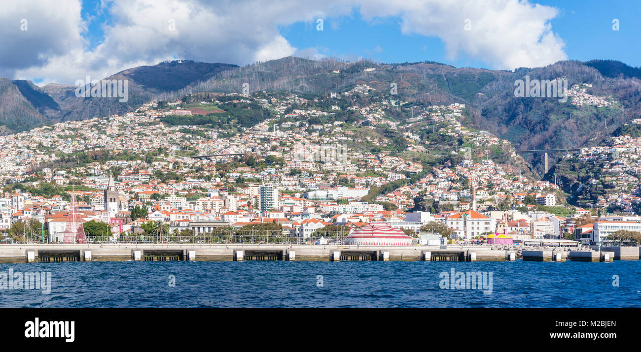 MADEIRA PORTUGAL MADEIRA Funchal seafront promenade with the city of ...