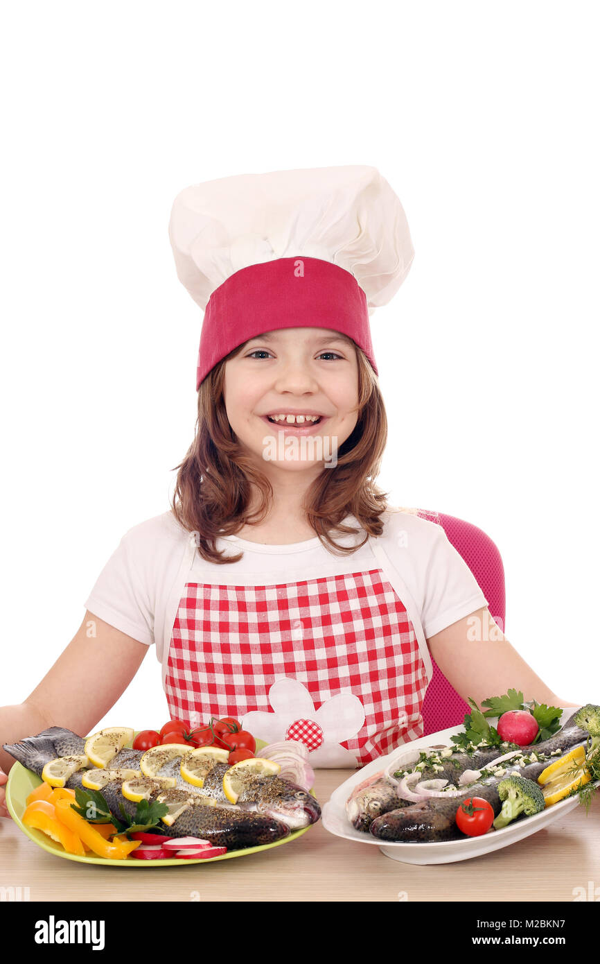 happy little girl cook with trout on plate Stock Photo - Alamy