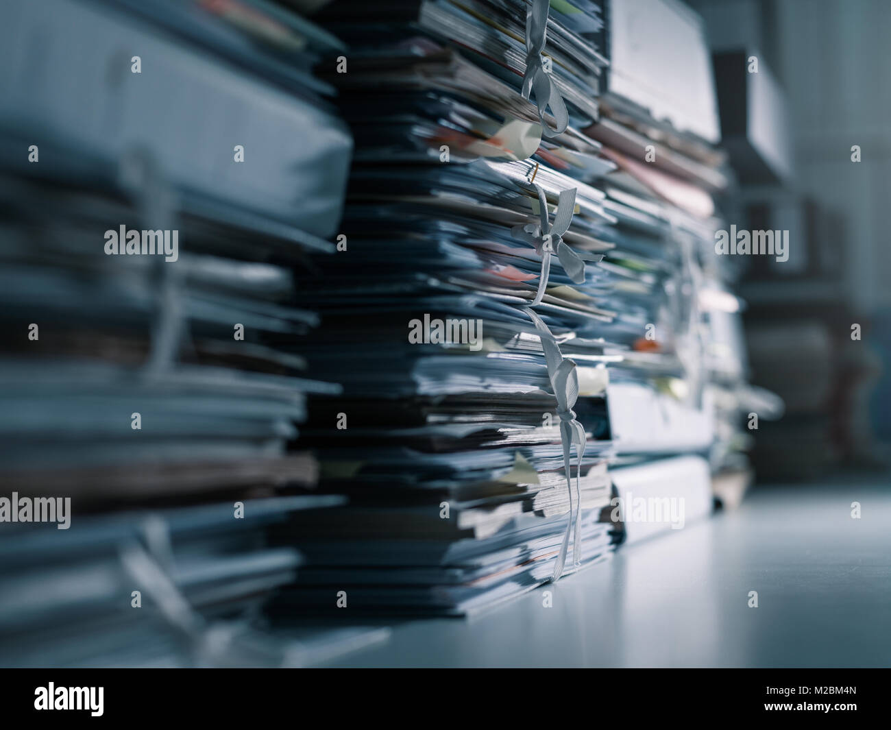 Stacks of paperwork and files in the office: work overload, files ...