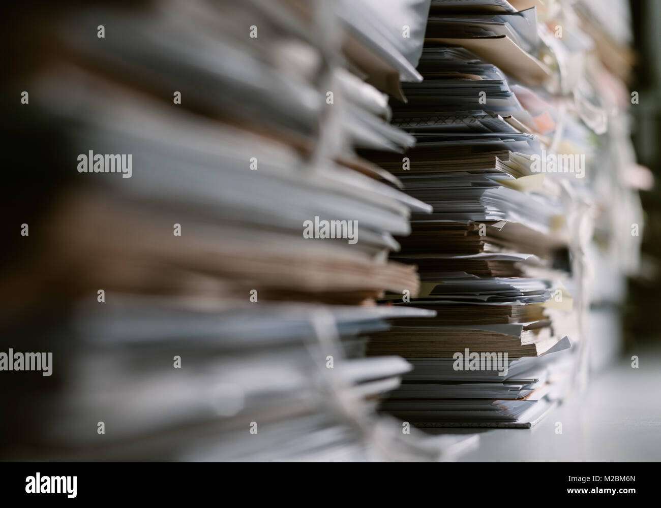 Stacks of paperwork and files in the office: work overload, files ...