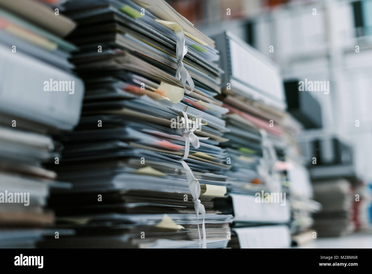 Stacks of paperwork and files in the office: work overload, files ...