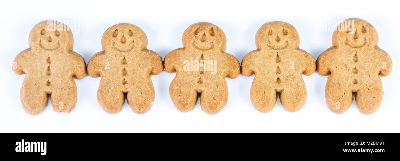group of gingerbread man standing together on a white background Stock ...