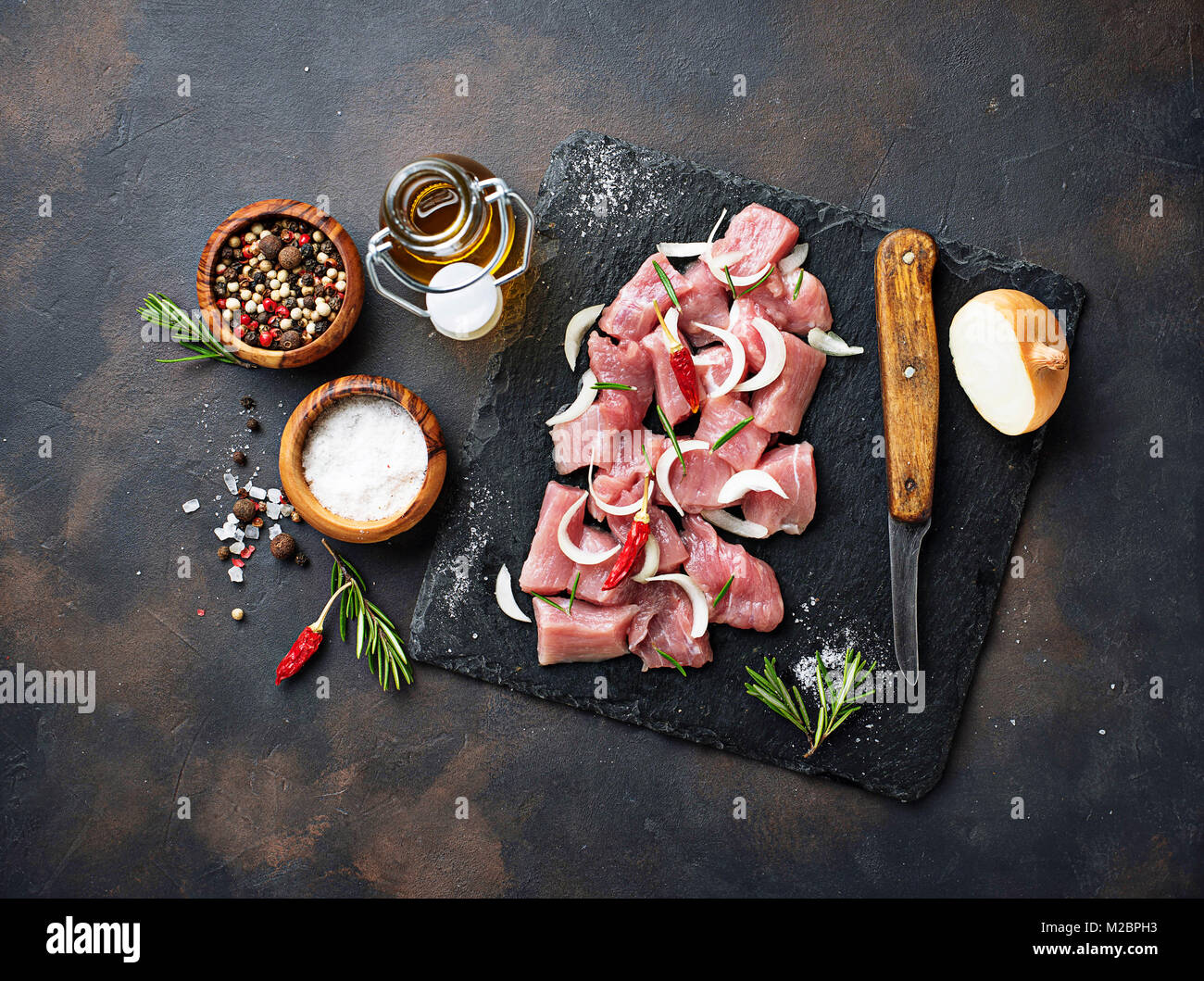 Raw chopped meat with spices on rusty background Stock Photo - Alamy