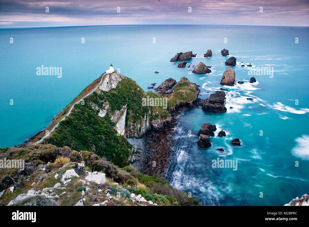 New Zealand, South Island, The Catlins, Nugget Point, lighthouse. Dusk ...