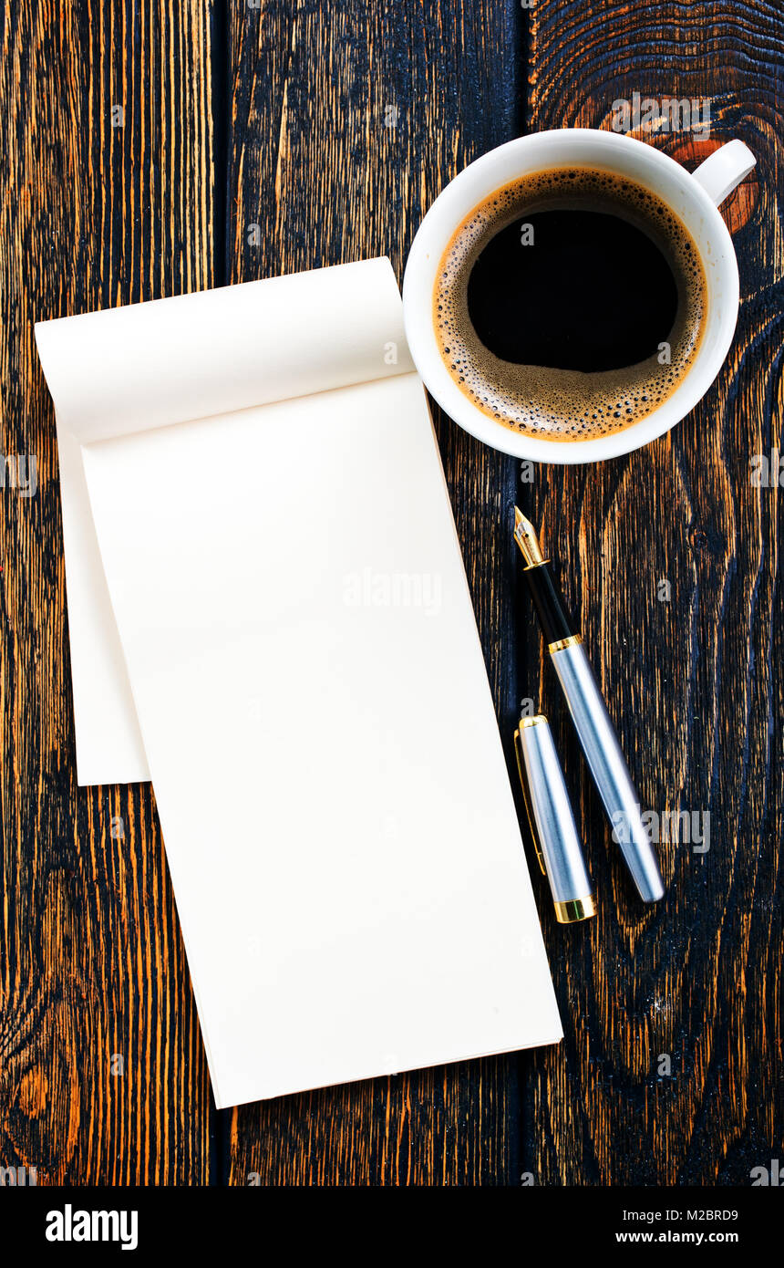 hot coffee in cup and paper for note Stock Photo - Alamy
