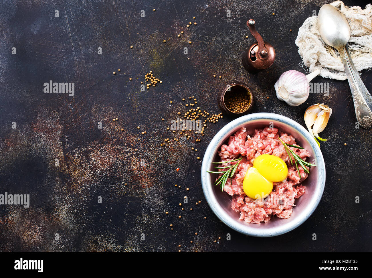 Minced meat with raw egg and salt Stock Photo - Alamy