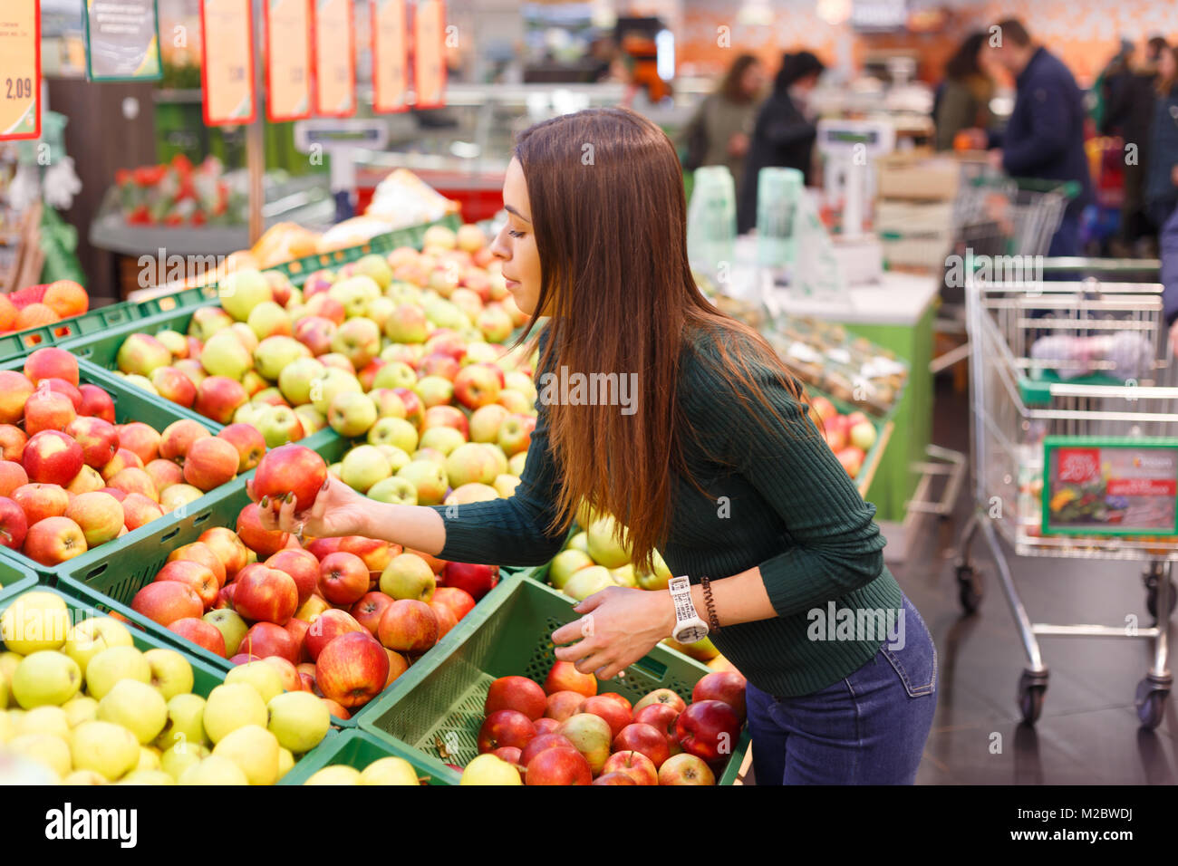 Beautiful woman buying fresh fruit and vegetables healthy eating hi-res ...