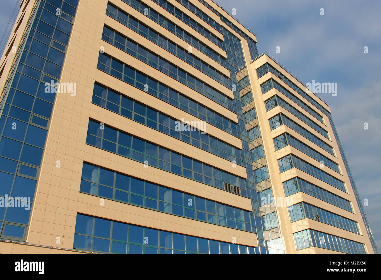 Modern office building wall made of blue glass and steel frame ...