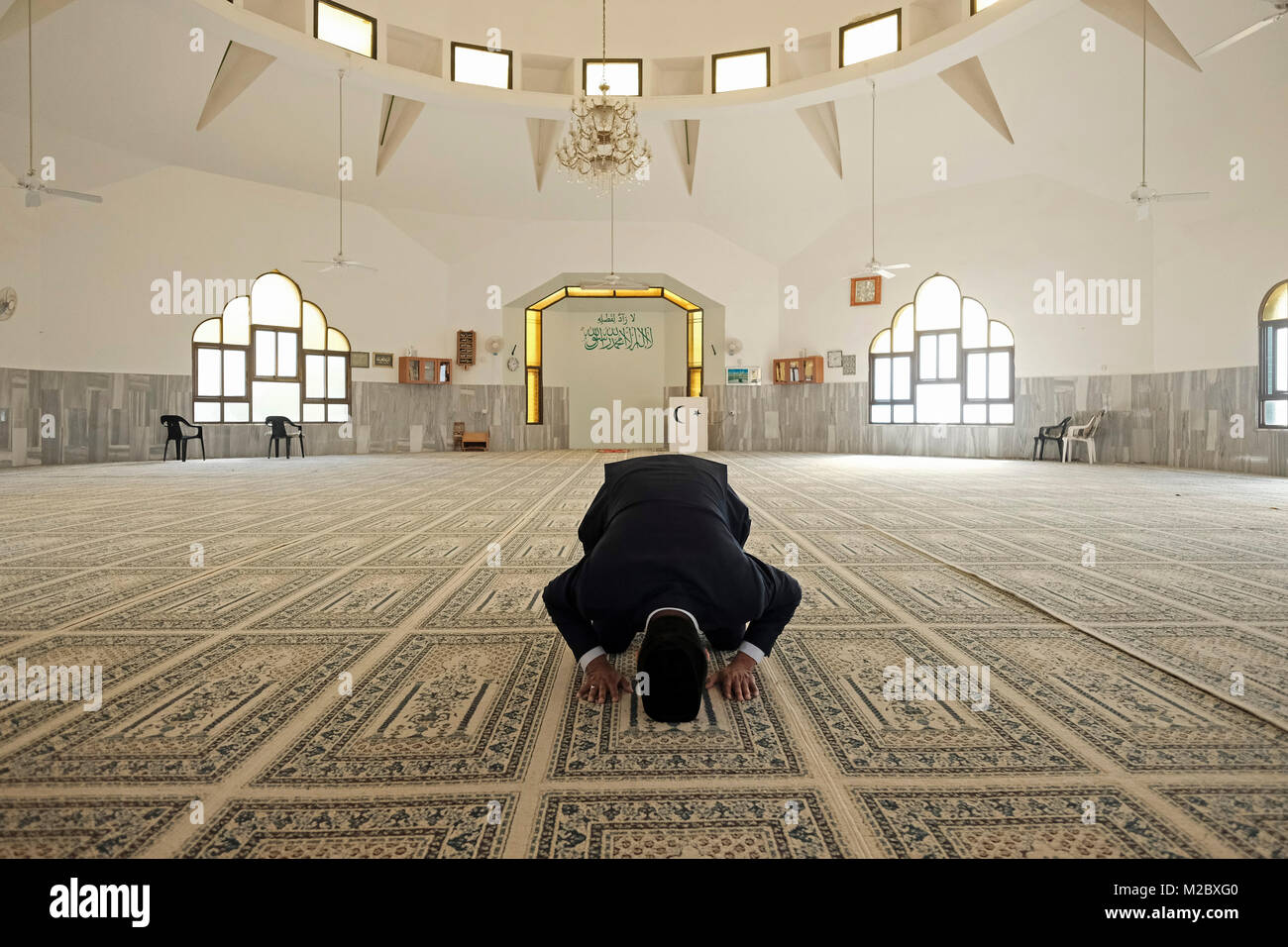 A member of the Ahmadiyya Muslim Community in Israel pray at Mahmood ...