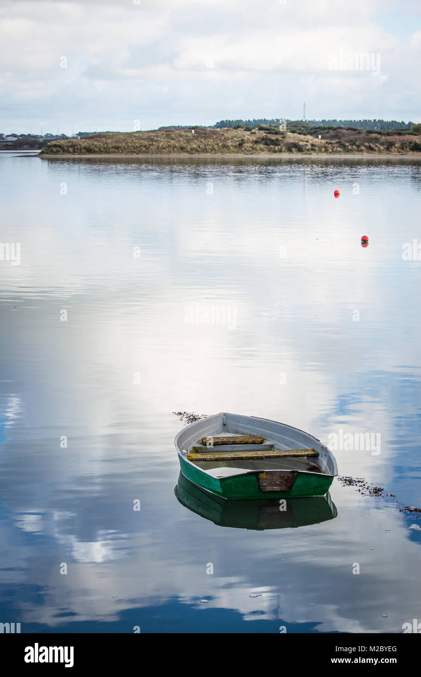 Little boat on calm water Stock Photo - Alamy