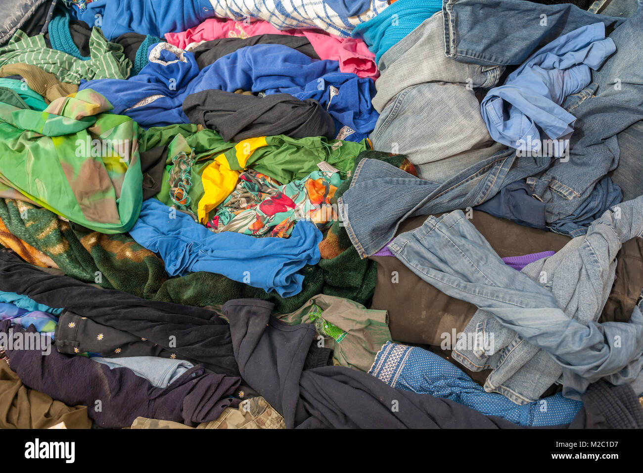 A collection of used clothing destined to be recycled in New York at a ...