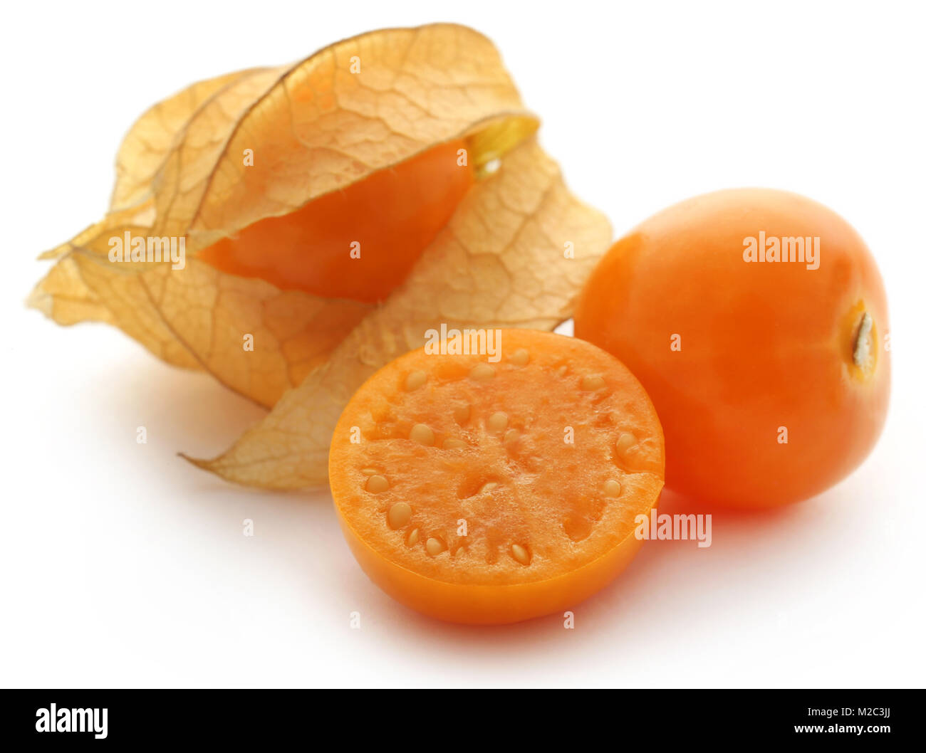 Fresh edible physalis over white background Stock Photo - Alamy