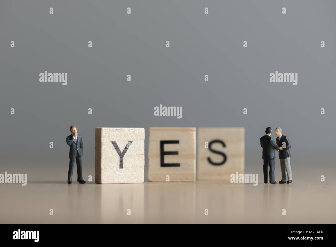 Wooden tiles with letters spelling out the word Yes. Business concept ...