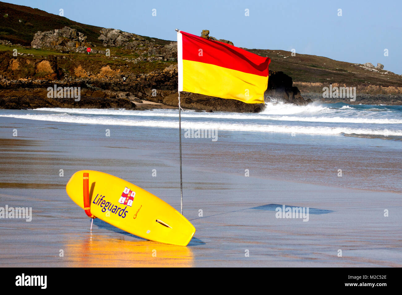 Lifeguard flag on Porthmeor beach in Cornwall Stock Photo - Alamy
