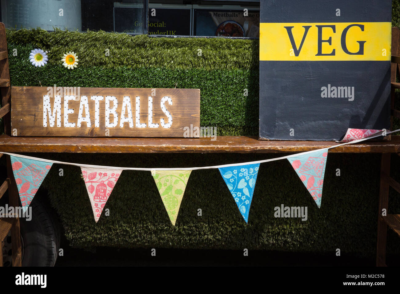 Meatballs and veg sign with bunting at wedding Stock Photo - Alamy