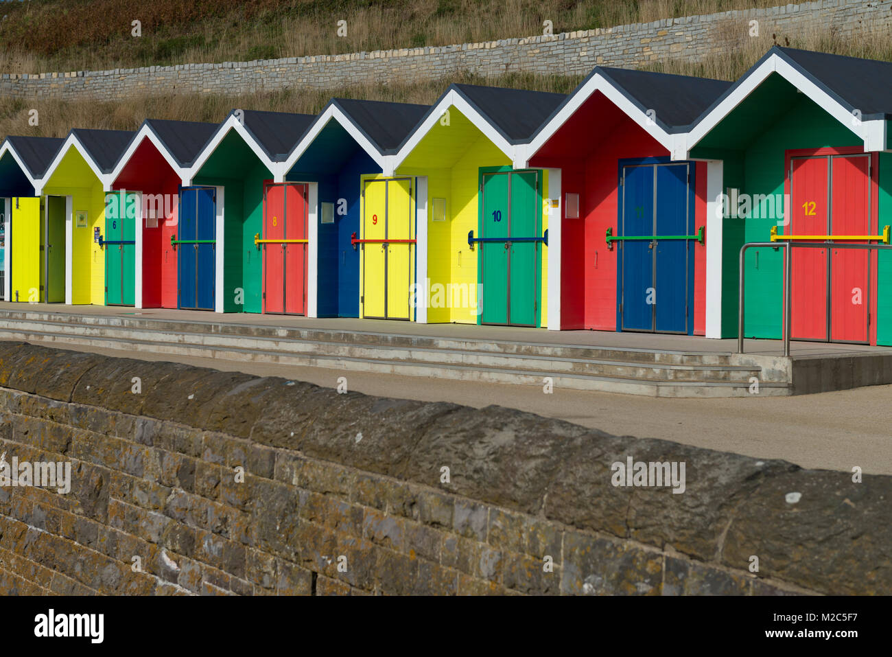 Colourful beach huts overlooking Whitmore Bay, Barry Island, Wales, UK ...