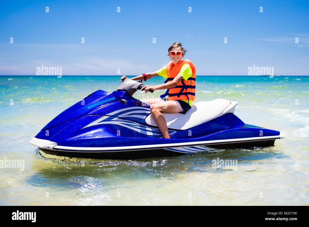Teen on jet ski hi-res stock photography and images - Alamy