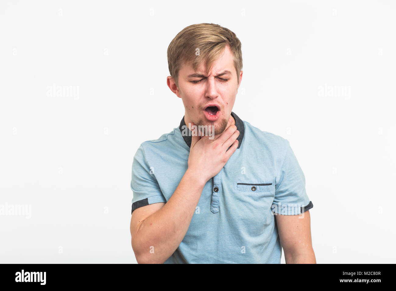Sore throat. Men touching the neck. Sick guy isolated Stock Photo - Alamy