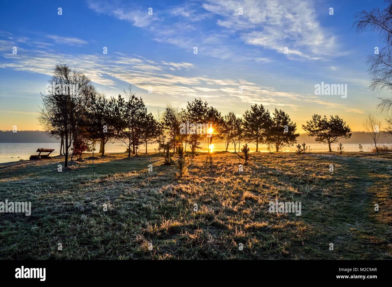 Beautiful sunny landscape. Morning sun on the lake Stock Photo - Alamy