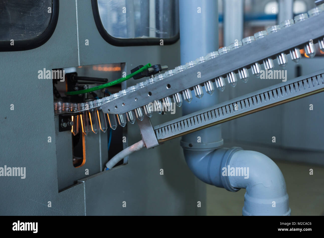 Plastic bottle making process Stock Photo - Alamy