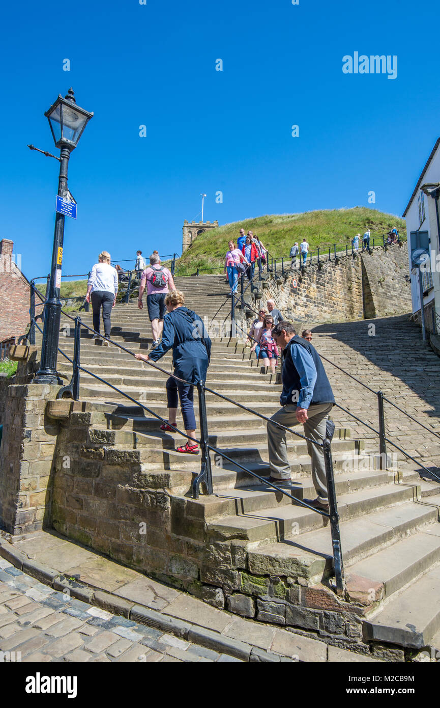 Tourists climb steep 199 steps up towards Whitby Abbey, Whitby ...