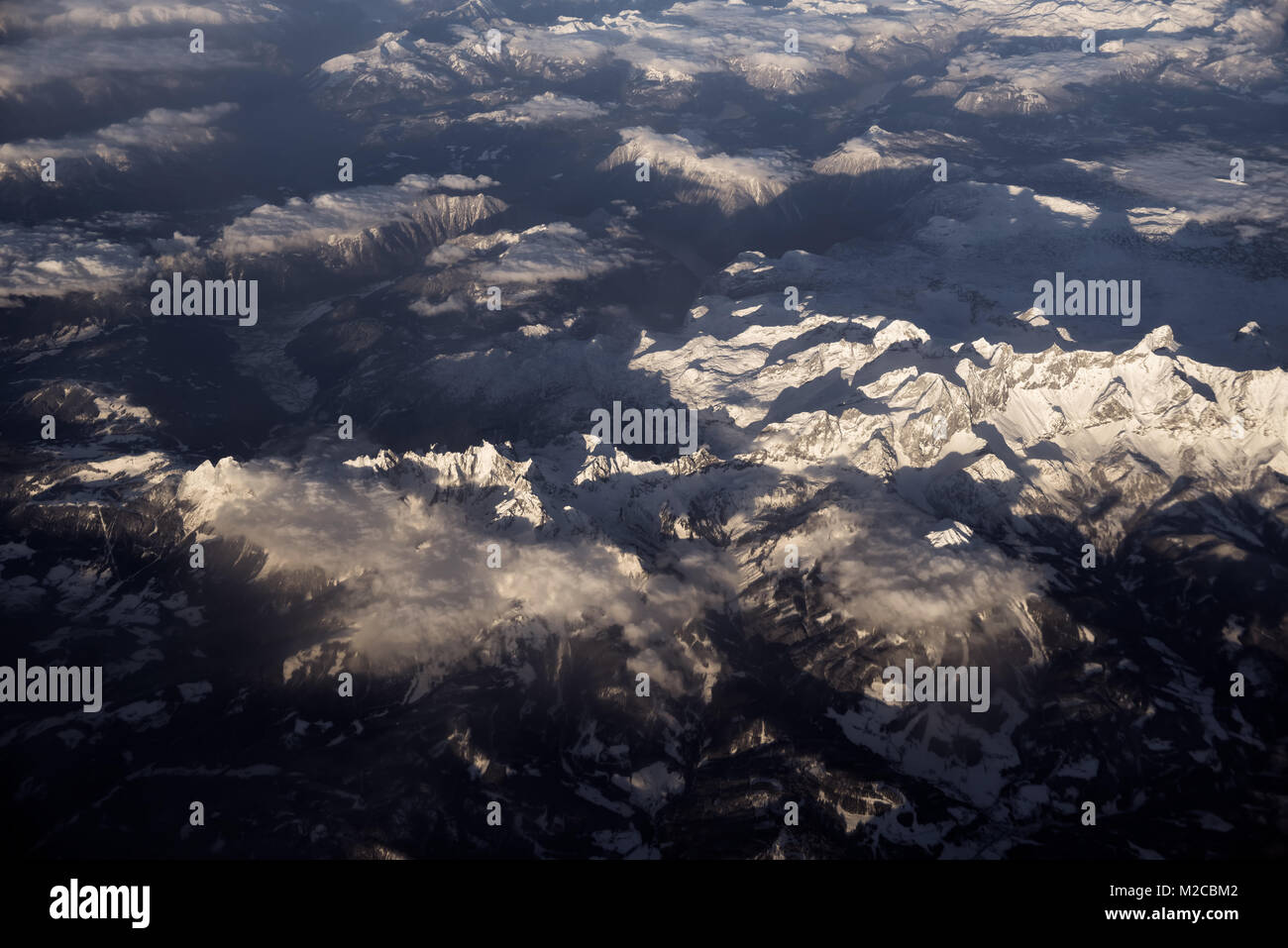 View on Alps from airplane Stock Photo - Alamy