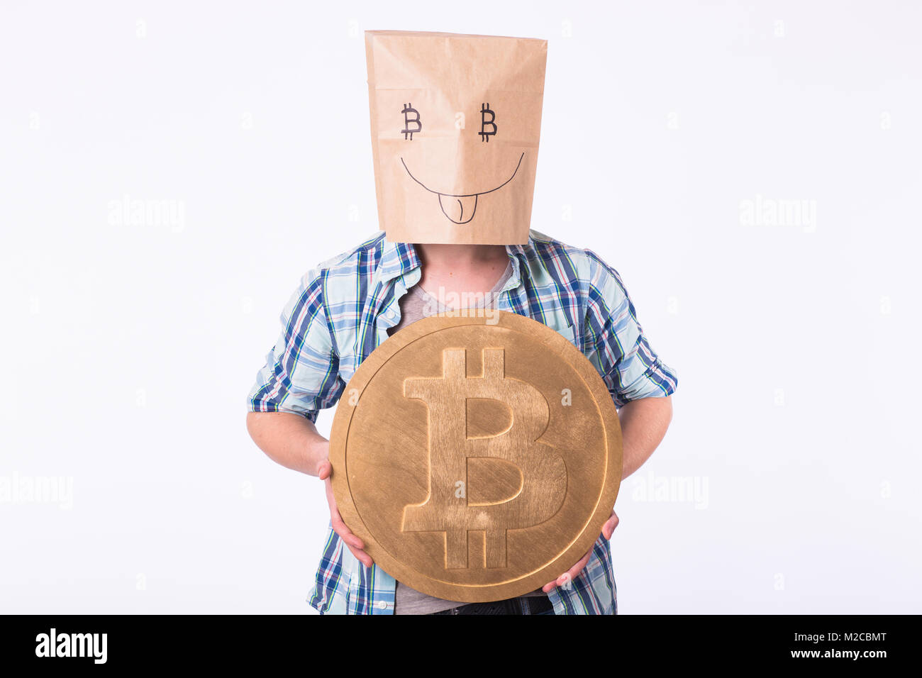 Golden Bitcoin in a funny man hand, Digitall symbol of a new virtual ...