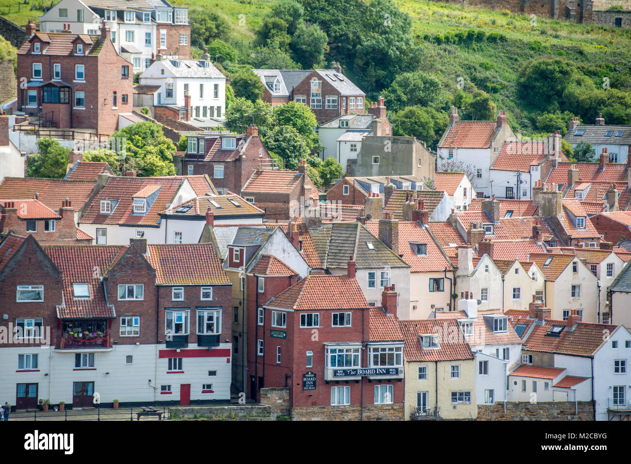 City scape of tightly arranged row houses, Whitby, Yorkshire, UK Stock ...