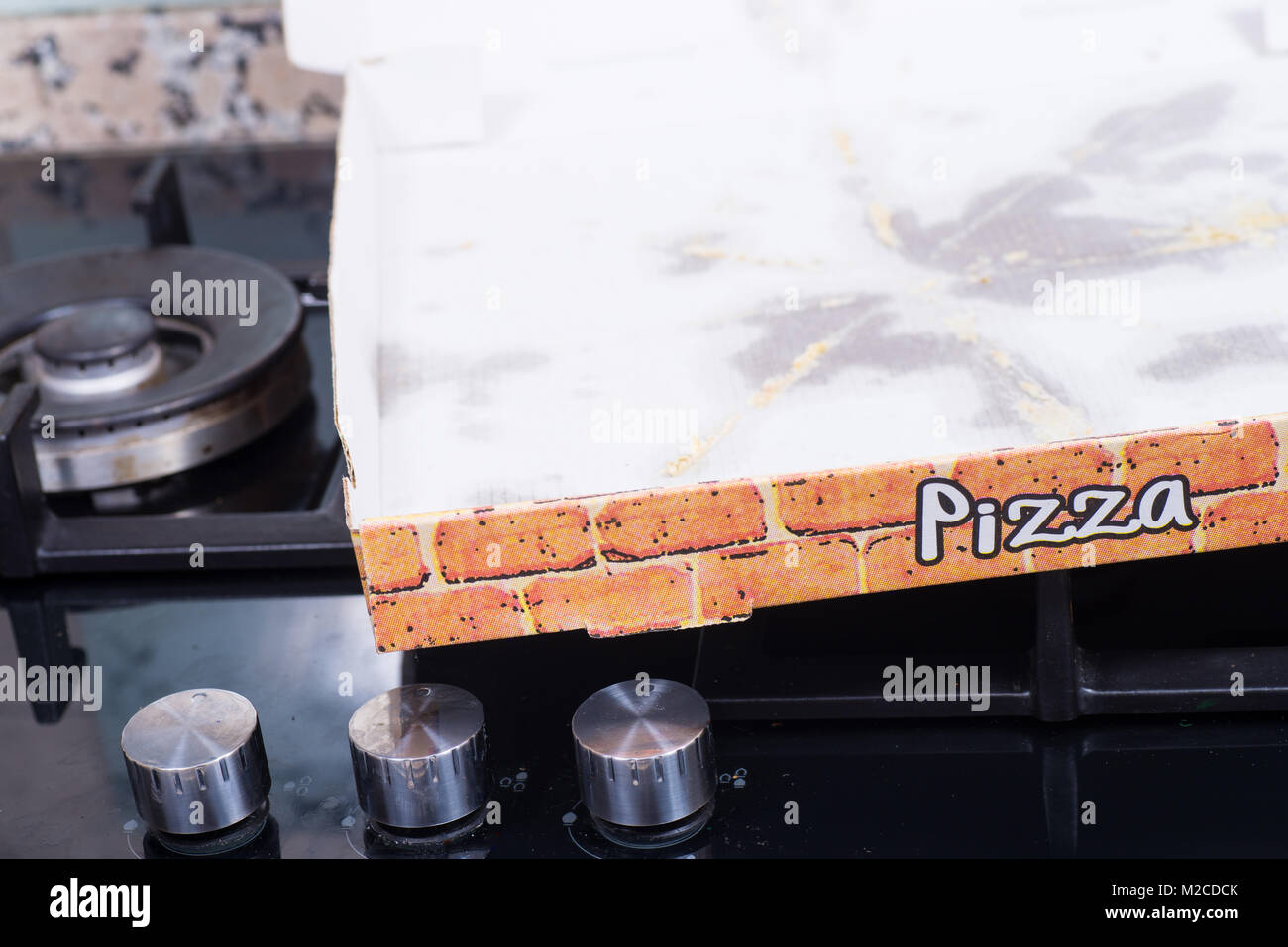 Used cardboard pizza box with grease stains lesft on its bottom Stock ...