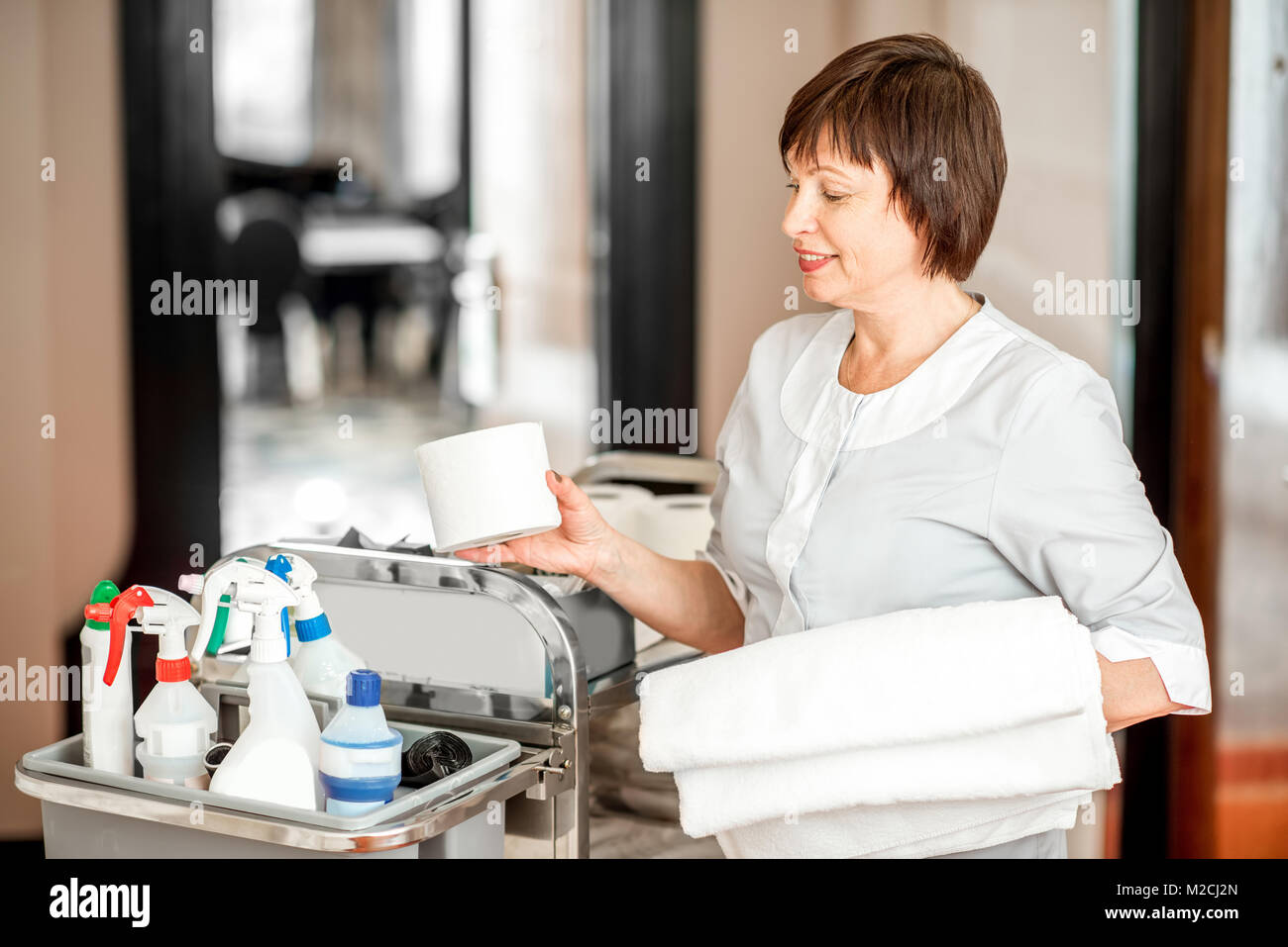 Chambermaid in the hotel corridor Stock Photo - Alamy